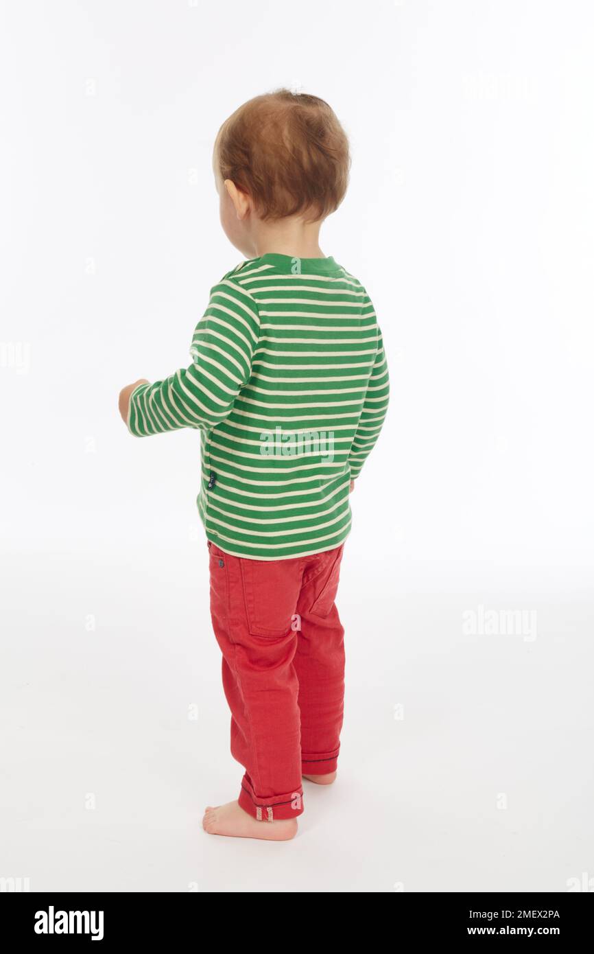 Little boy in green stripey top playing, various poses (Model age - 22 ...