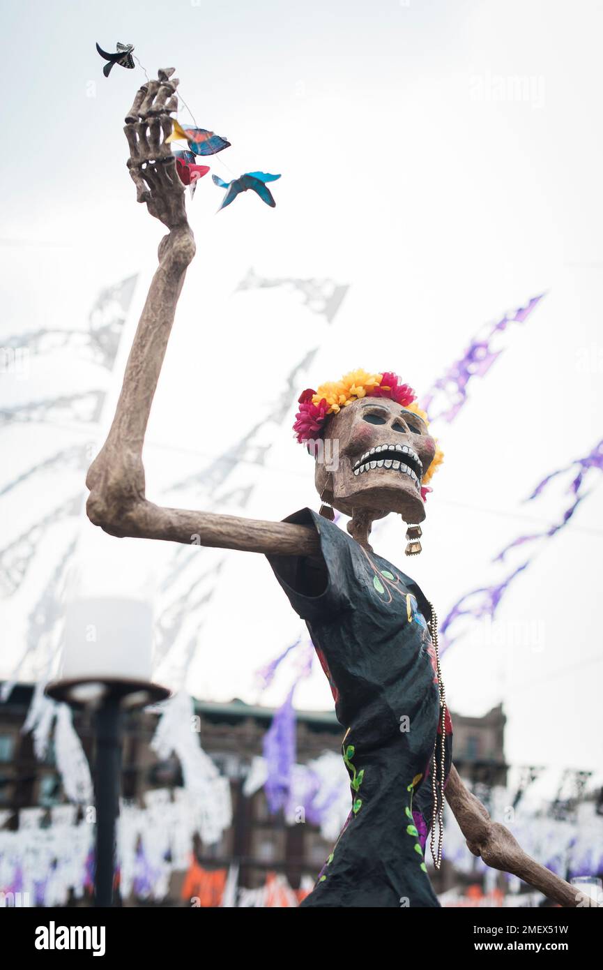 A skeleton parade float wearing a flower crown for the Day of the Dead ...