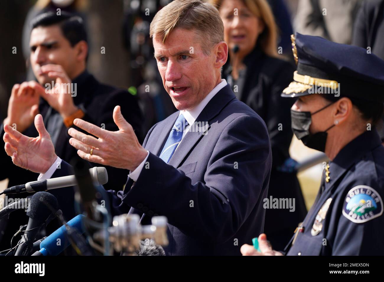 Boulder, Colo., Police Department Chief Maris Herold, front, listens as ...