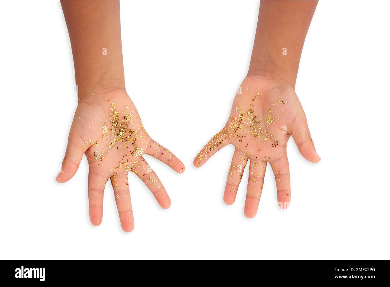 Gold glitter on child hands Stock Photo - Alamy