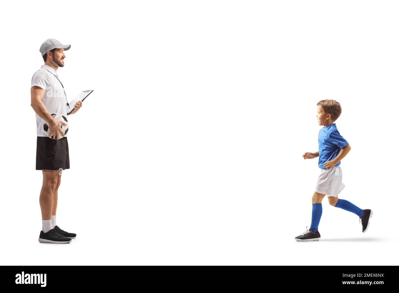 Boy running towards a football coach isolated on white background Stock ...