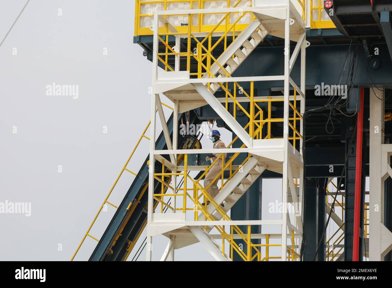 A Ugandan worker from China Oilfield Services Limited (COSL), a ...