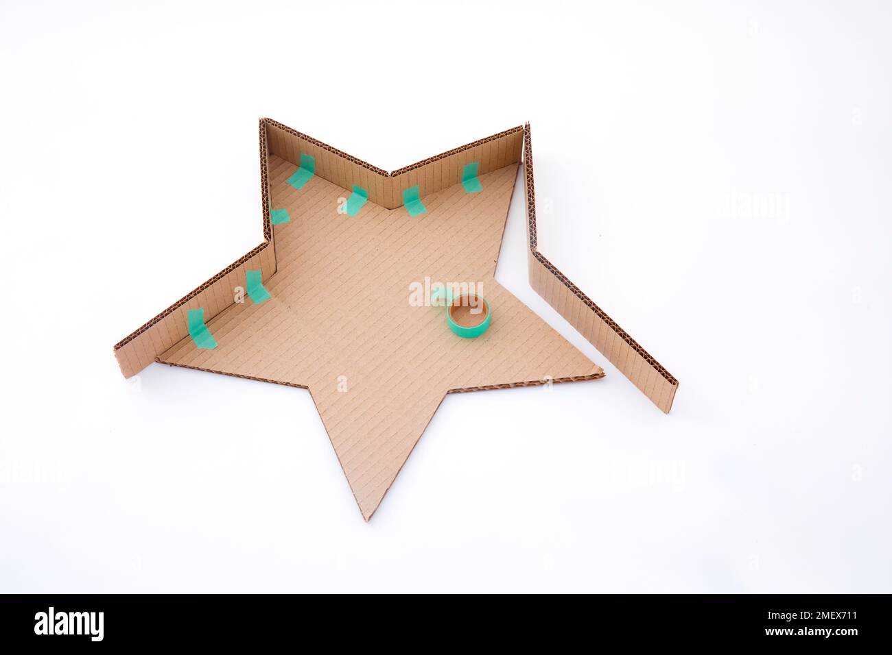 Pinata craft project - Step 3 - Attach side strips using paper tape ...