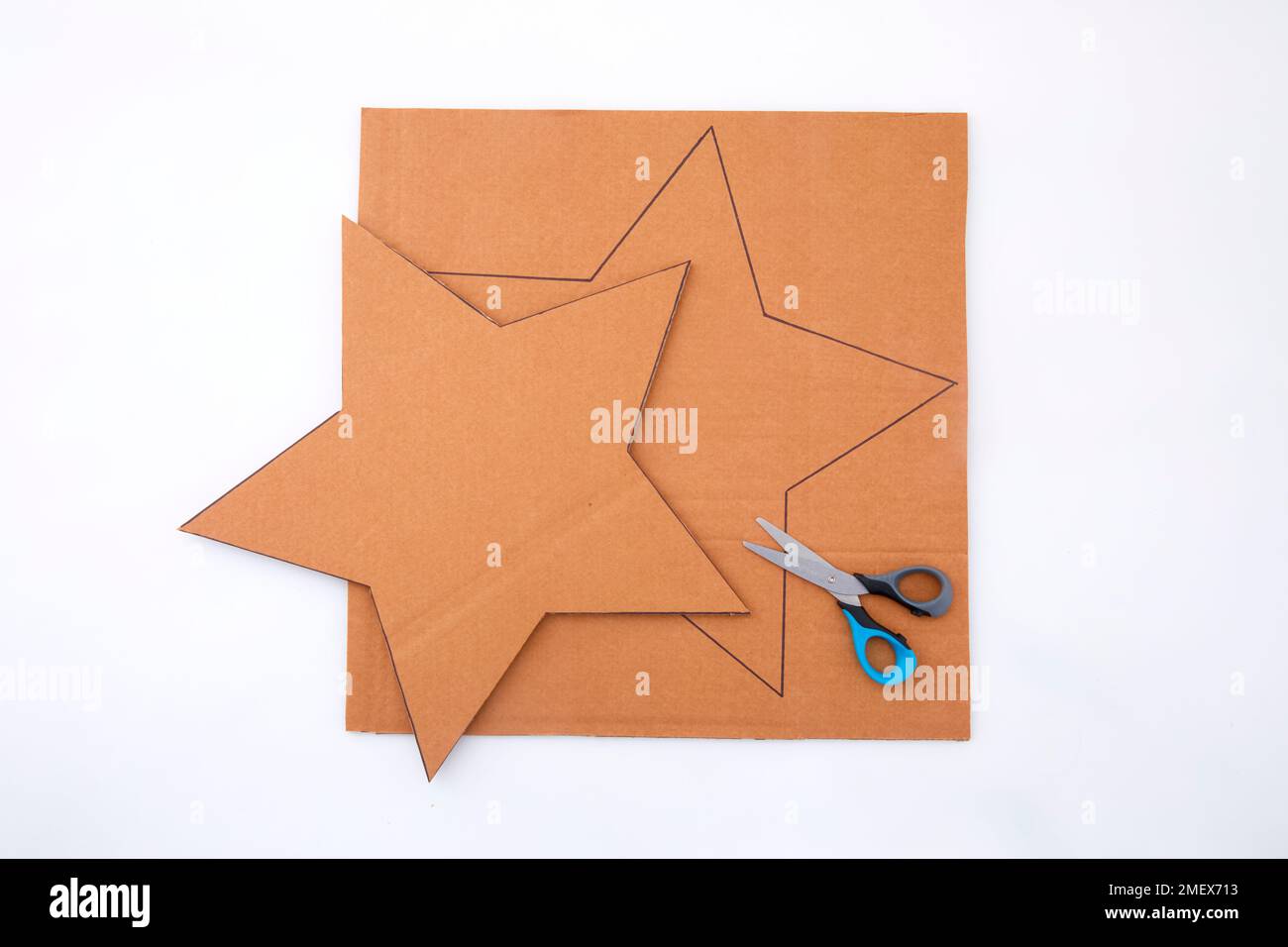 Pinata craft project - Step 1 - Draw and cut star shape from two pieces ...