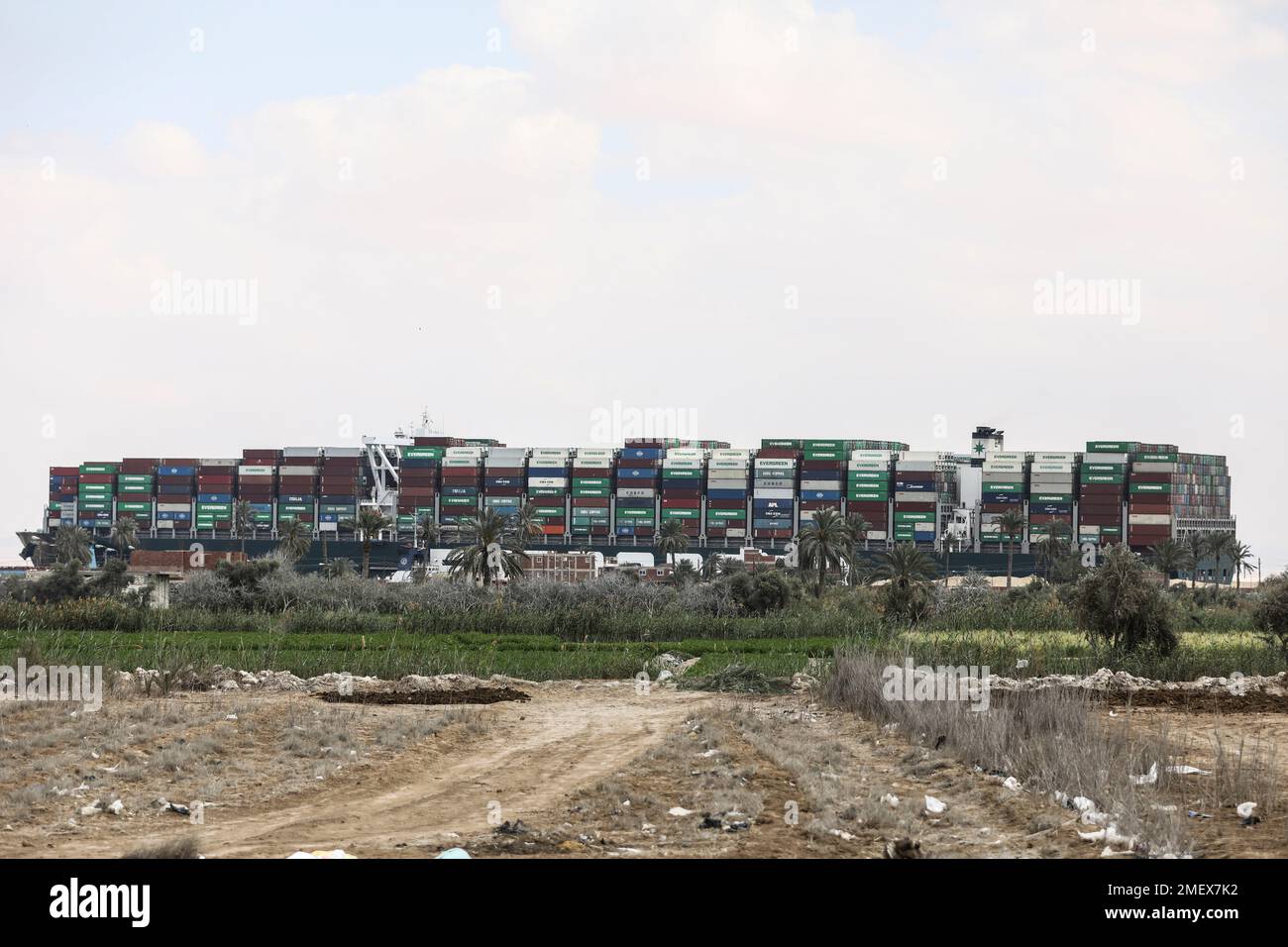 Ever Given, a Panama-flagged cargo ship, that is wedged across the Suez ...