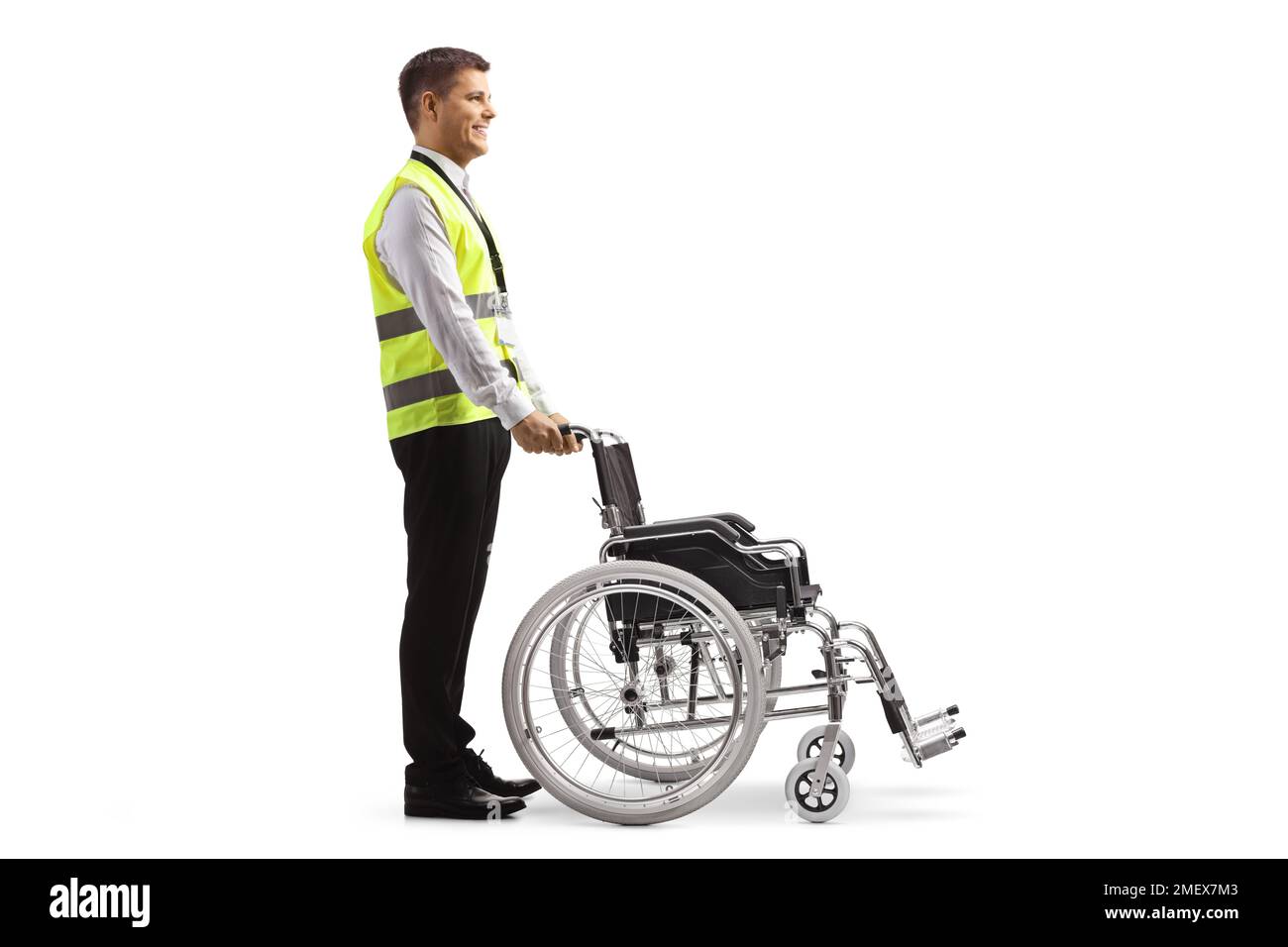 Full length profile shot of a security guard standing behind a ...