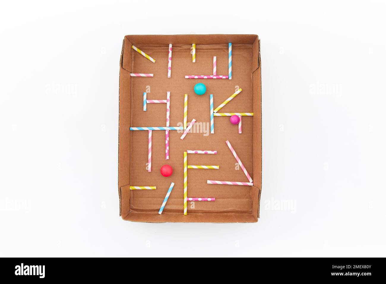 Cardboard craft - Marble maze project recycled straws and beads Stock ...