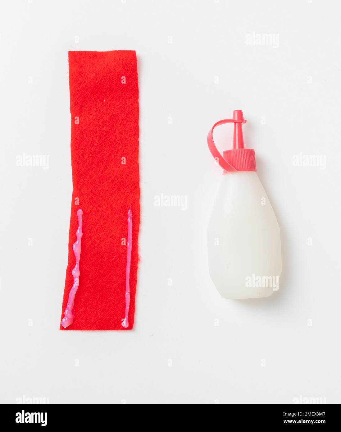 Strip of red felt with glue Stock Photo - Alamy