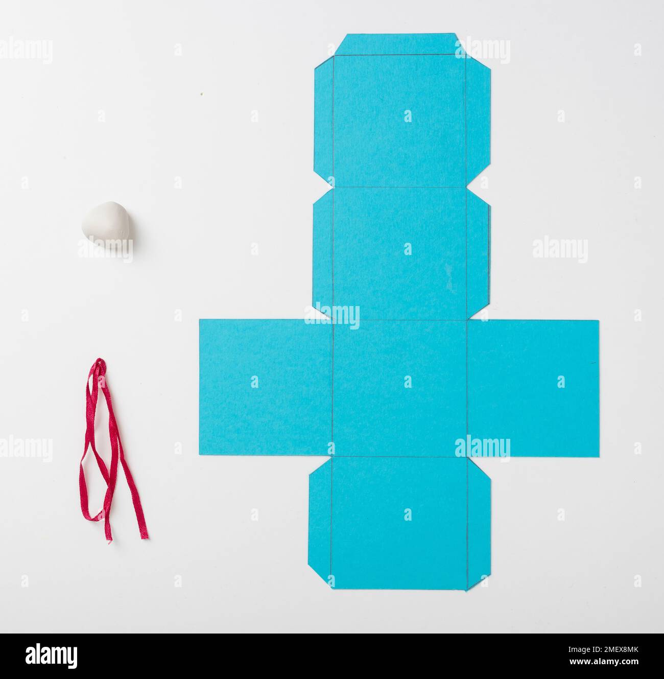 Cardboard net, red ribbon, white tac Stock Photo - Alamy