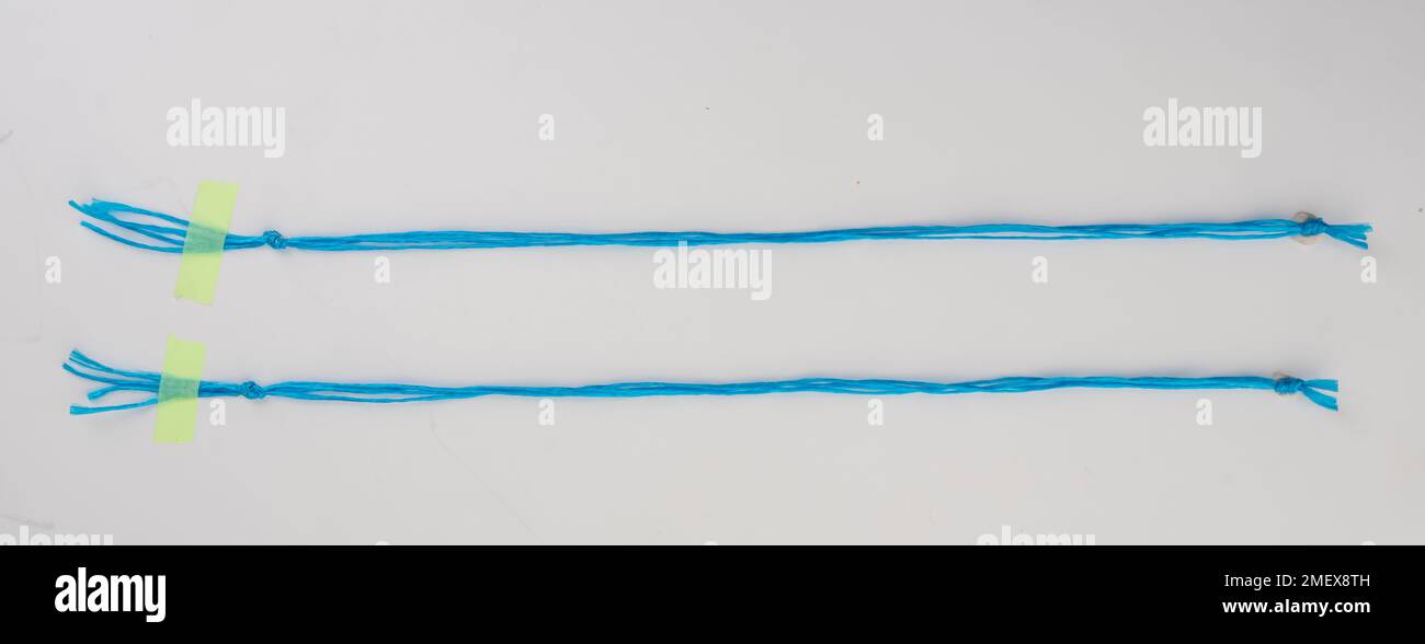 Sting tied with knots on both ends hi-res stock photography and images ...