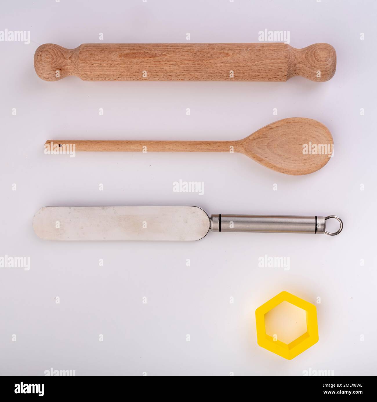 Rolling pin, wooden spoon, hexagon cutter, palette knife Stock Photo ...
