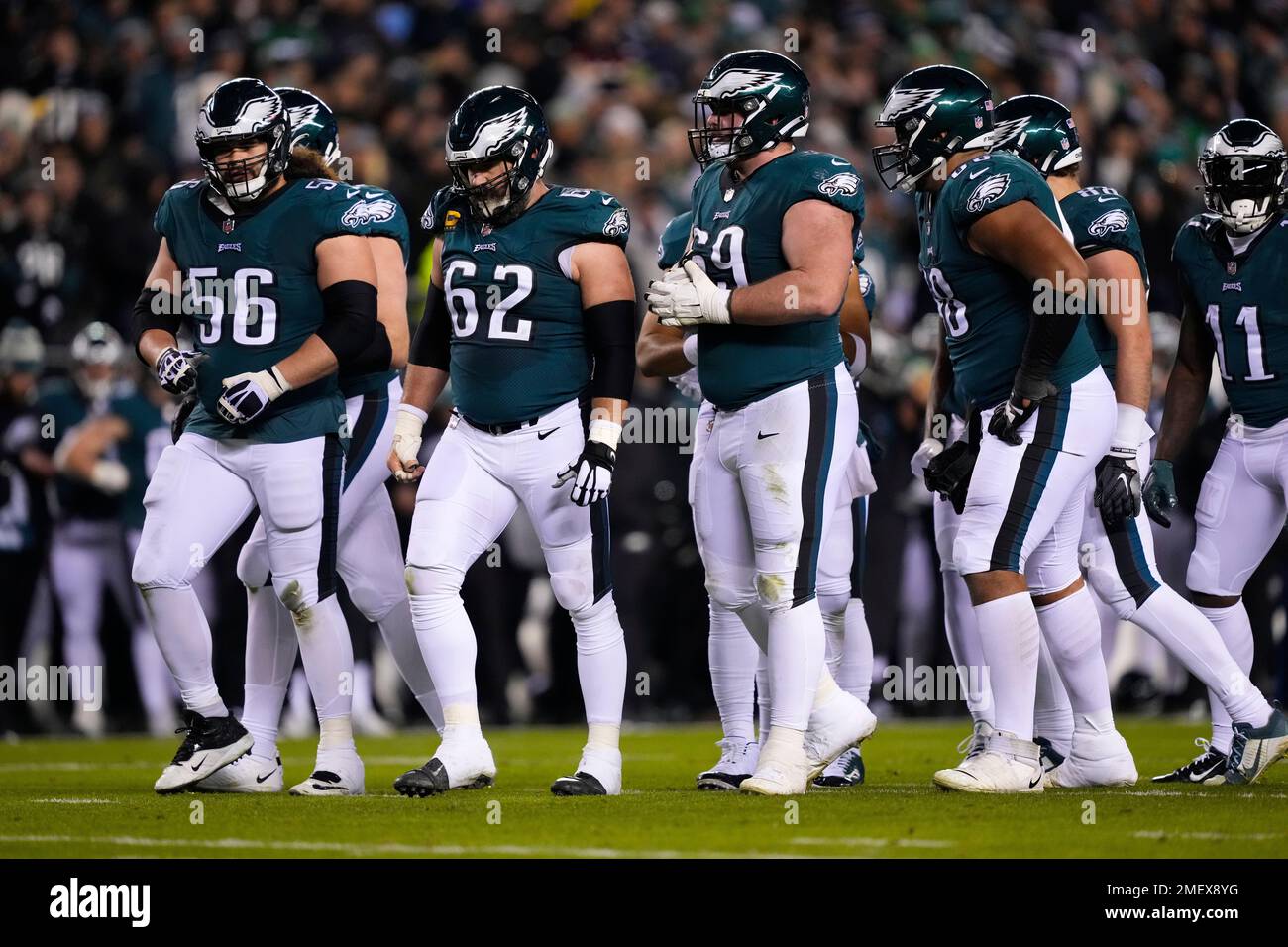 Members of the Philadelphia Eagles huddle during an NFL divisional ...