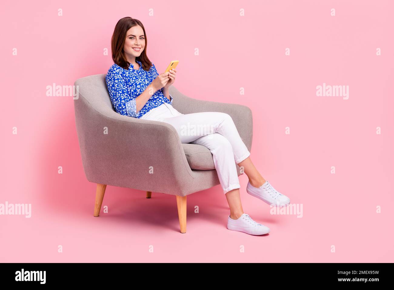 Full length photo of funny shiny lady wear print shirt typing apple ...