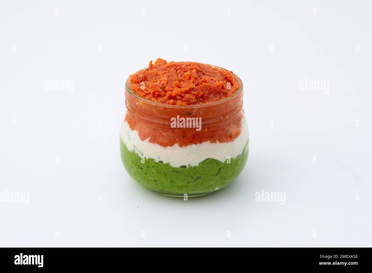 Layered dip pot - Pea and basil, creamy chive and tomato houmous Stock ...