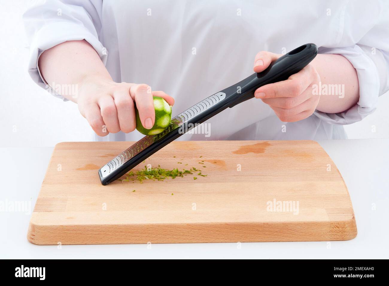 Cooking techniques - Zesting a lime Stock Photo - Alamy