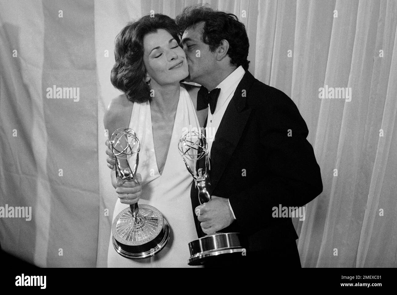 FILE - Peter Falk of "Columbo" gives Jessica Walter of "Amy Prentice" a kiss after both won ...