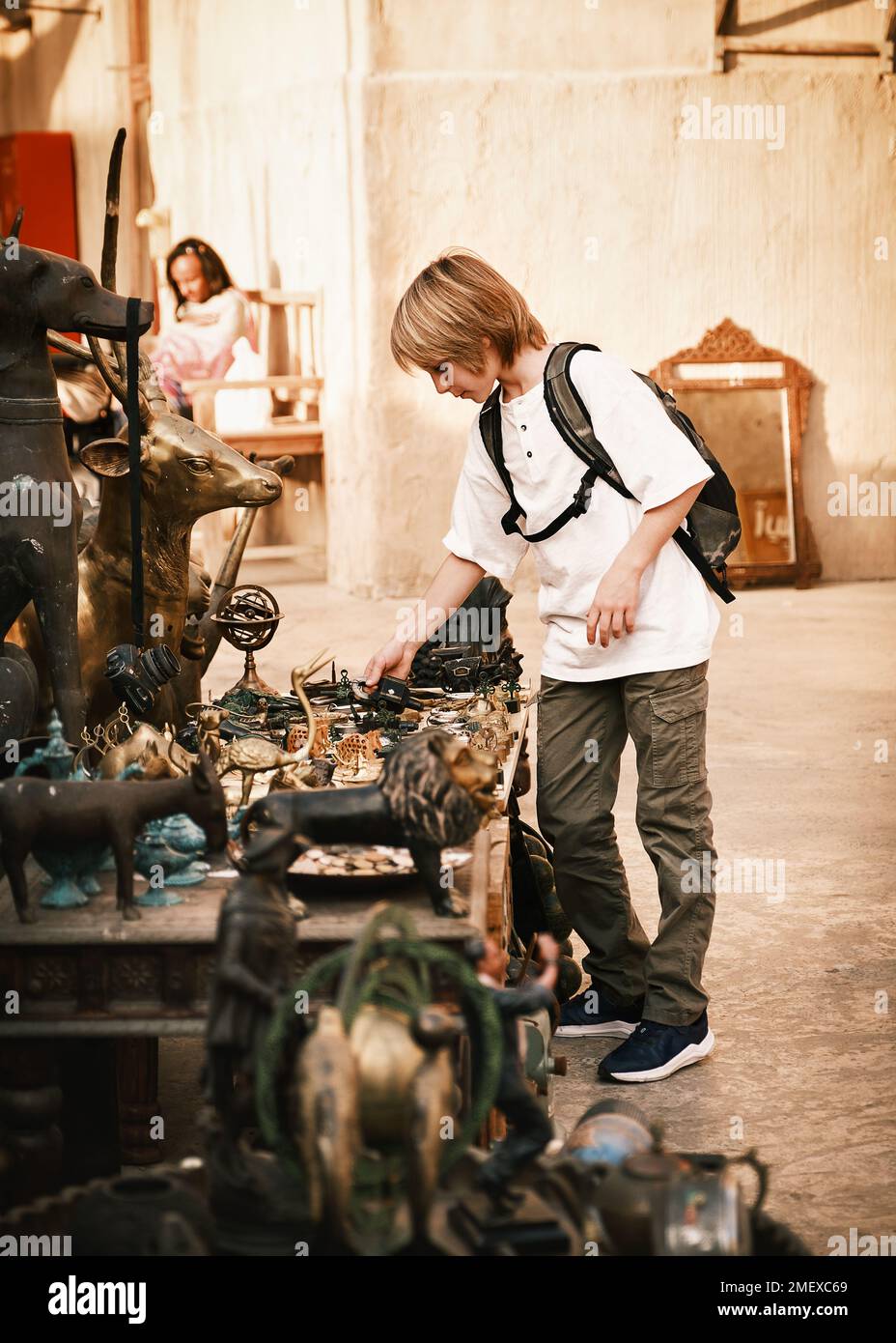 Boy in antique shop Stock Photo - Alamy