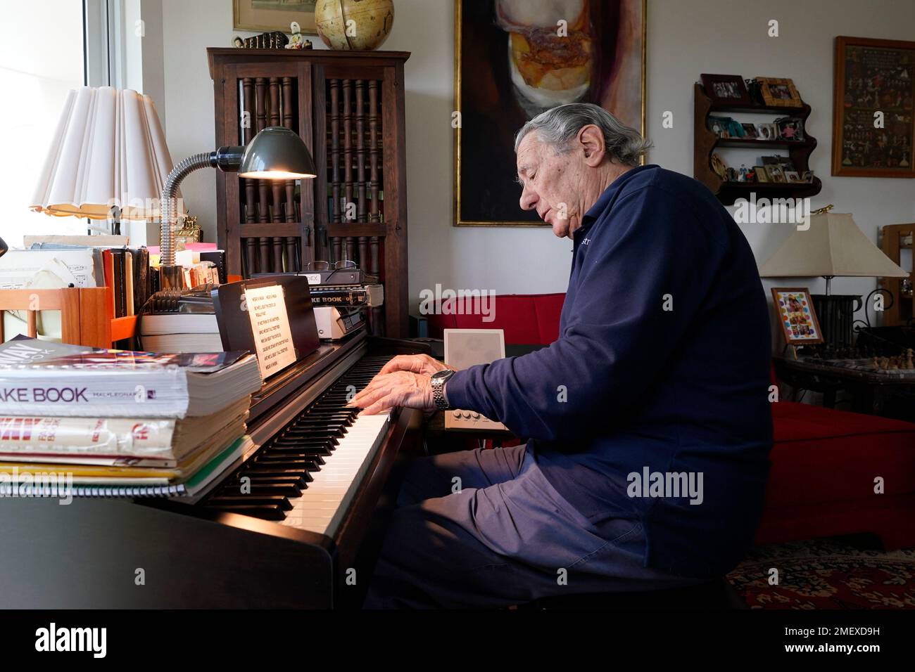 Peter Fuchs plays the piano at his home in Aventura Fla., Tuesday, Feb ...