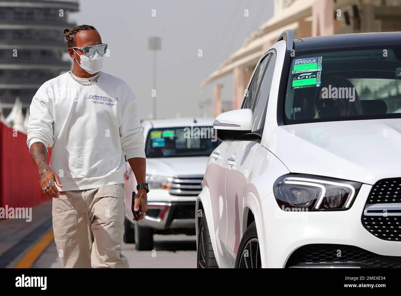 Mercedes driver Lewis Hamilton of Britain arrives to the Bahrain ...