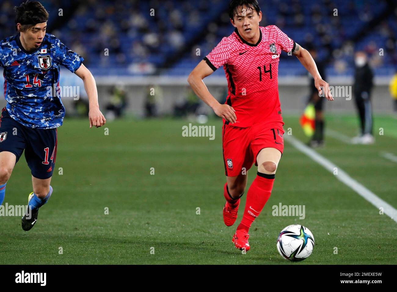 South Korea's Hong Chul, right, dribbles a ball chased by Japan's Junya ...