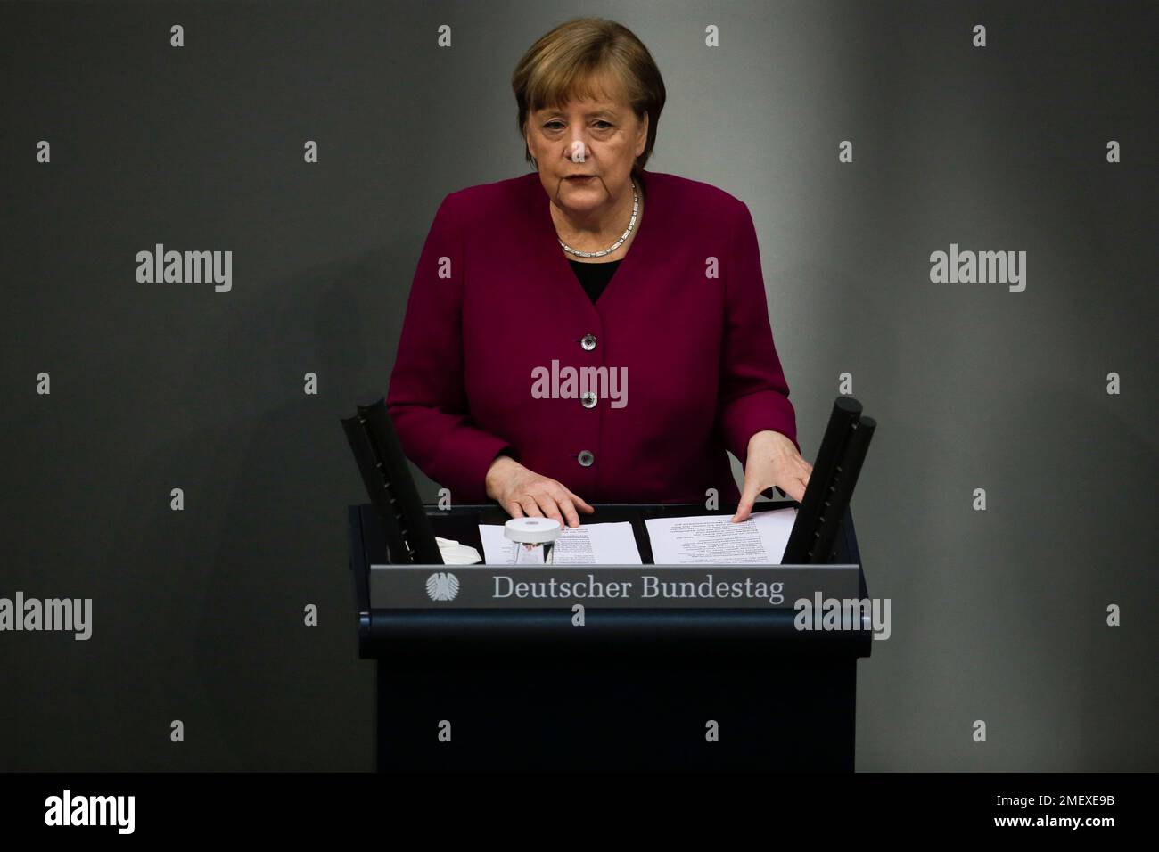German Chancellor Angela Merkel addresses the German parliament ...