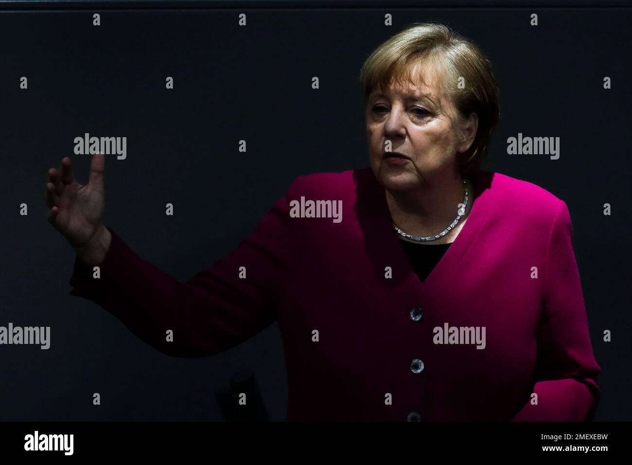 German Chancellor Angela Merkel addresses the German parliament ...