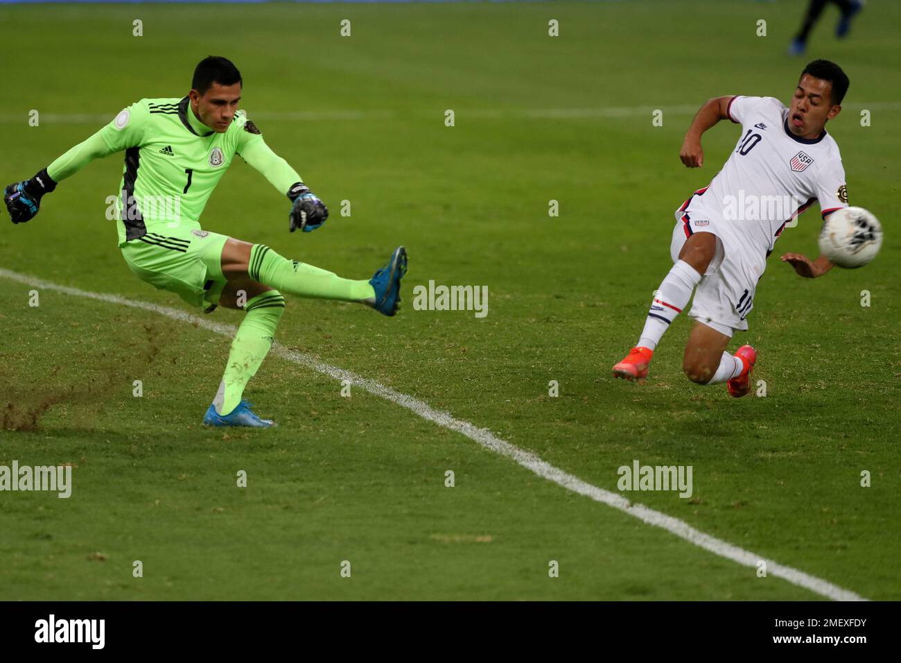 Mexico's goalkeeper Luis Malagon kicks the ball ahead of United States ...