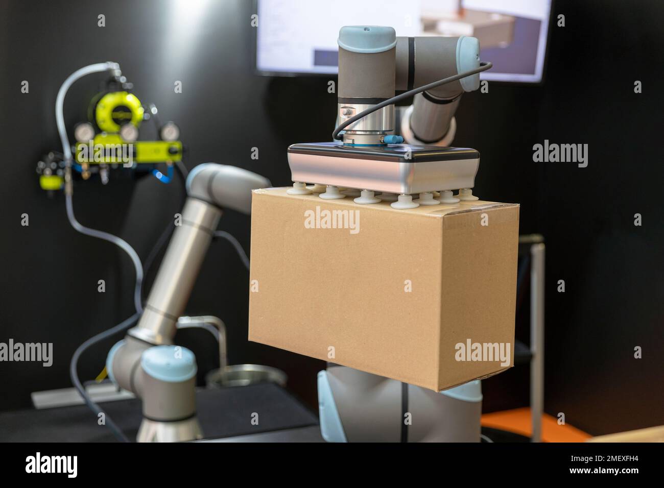 Robot or robotic arm for cardboard box packing Stock Photo - Alamy