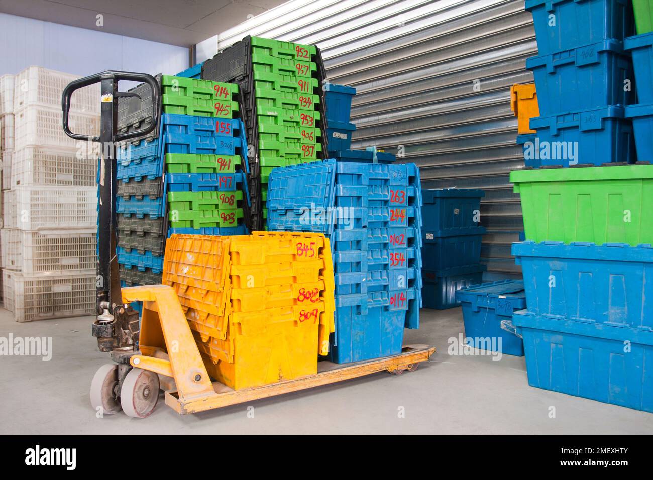 A close-up shot of plastic containers in a warehouse Stock Photo - Alamy