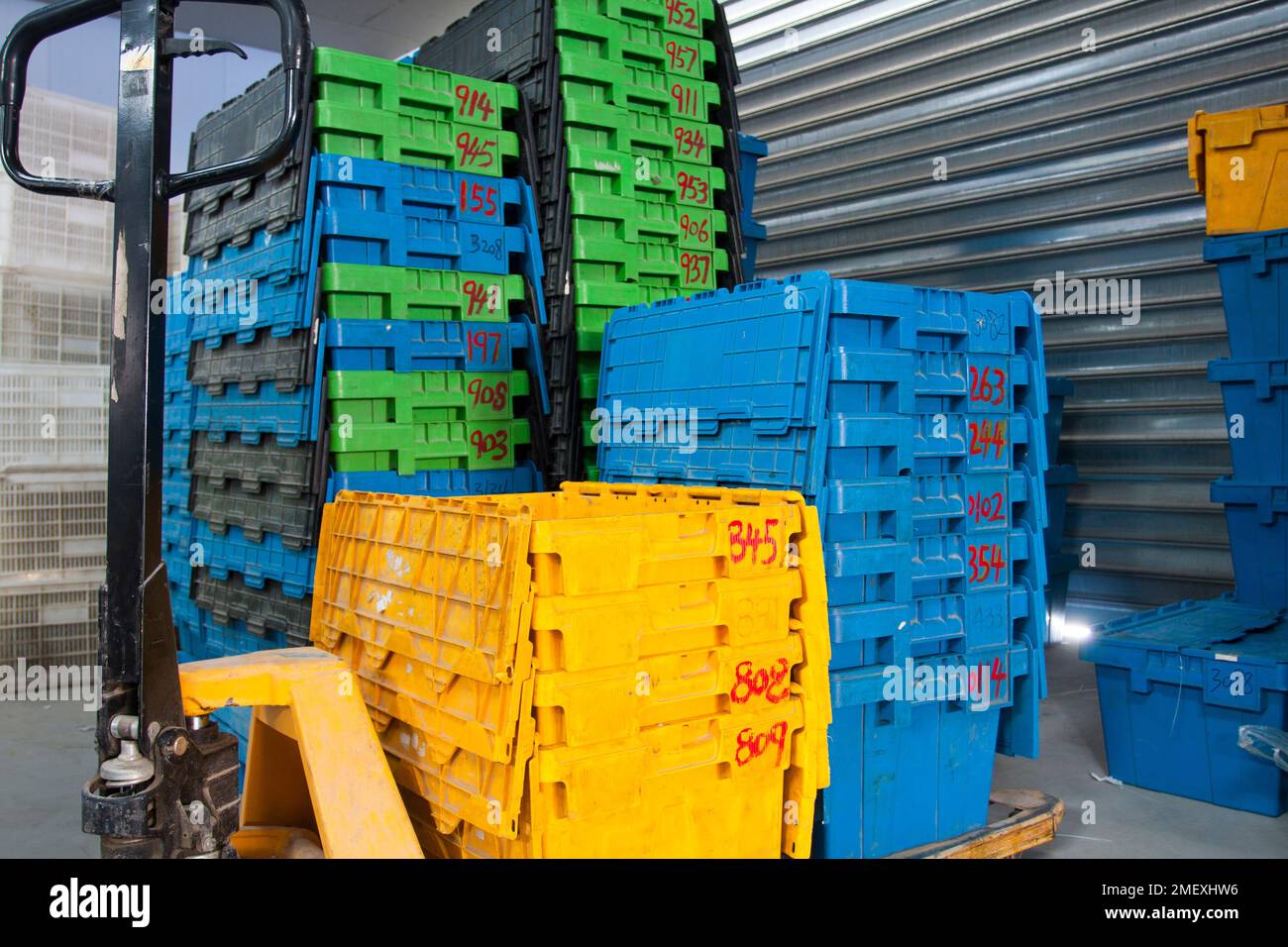 A close-up shot of plastic containers in a warehouse Stock Photo - Alamy