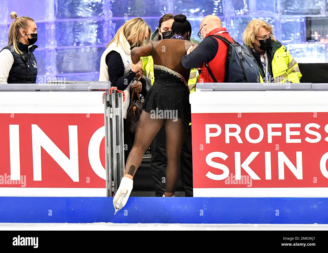 Mae Berenice Meite of France is treated after falling during the Ladies ...