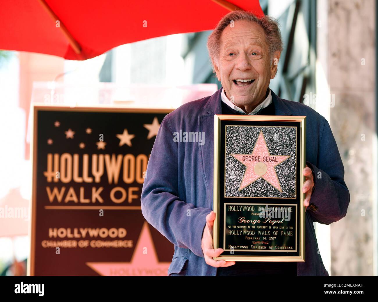 FILE - Actor George Segal poses with a replica of his star at a ...