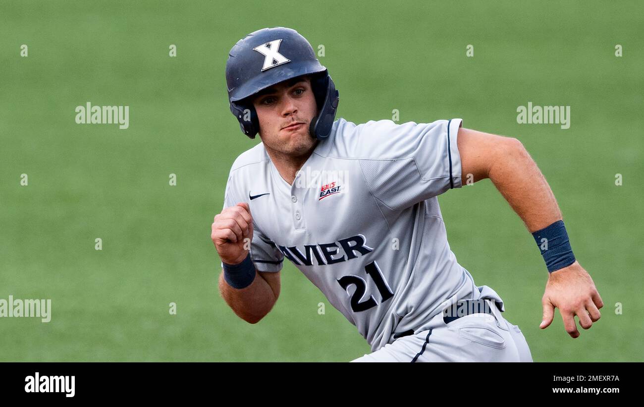Luke Stephenson (21) of Xavier runs the bases during an NCAA baseball ...