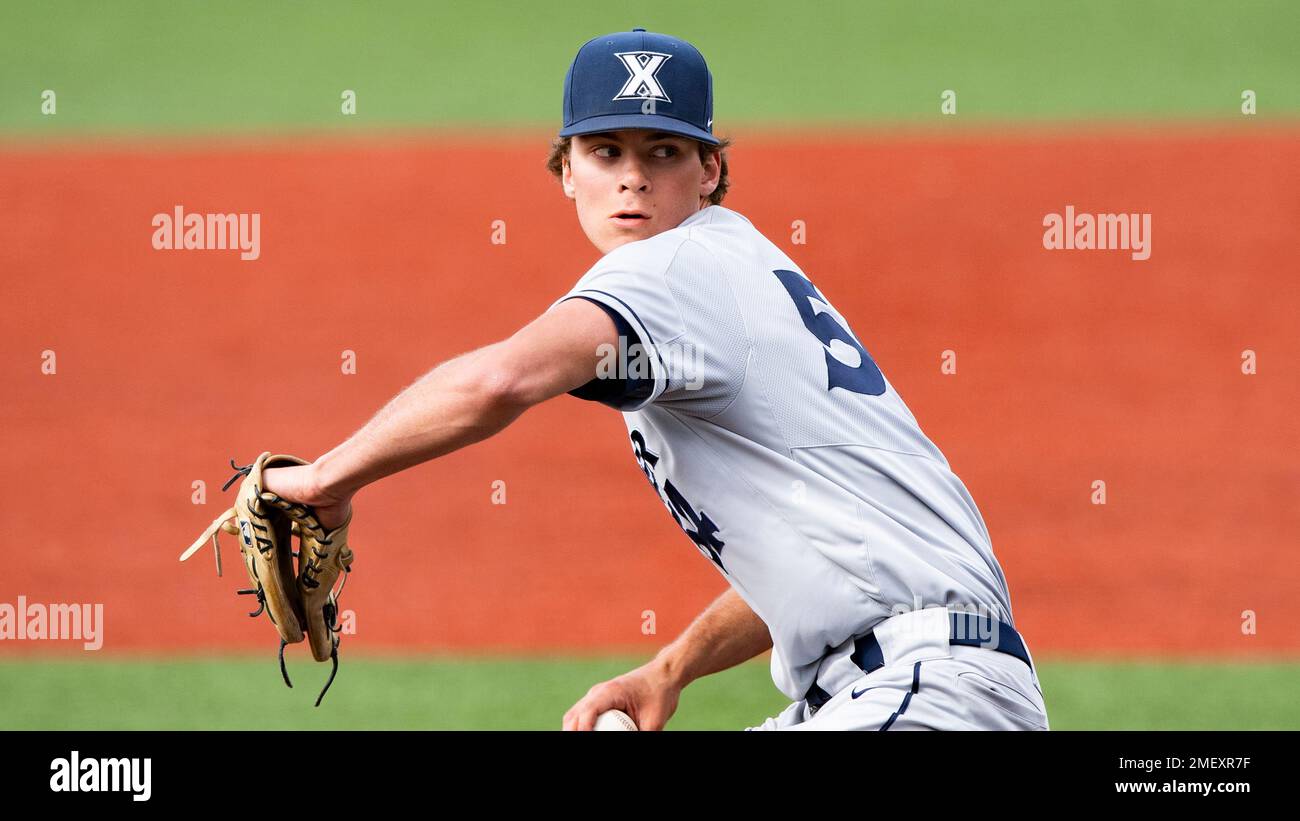 Connor Bailey (54) of Xavier delivers a pitch during an NCAA baseball ...