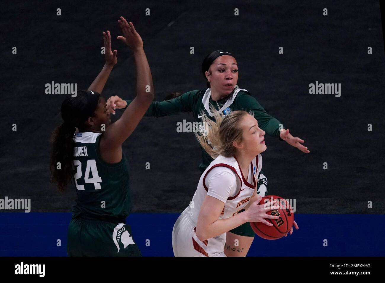 Iowa State guard Kylie Feuerbach, front right, looks to pass under ...
