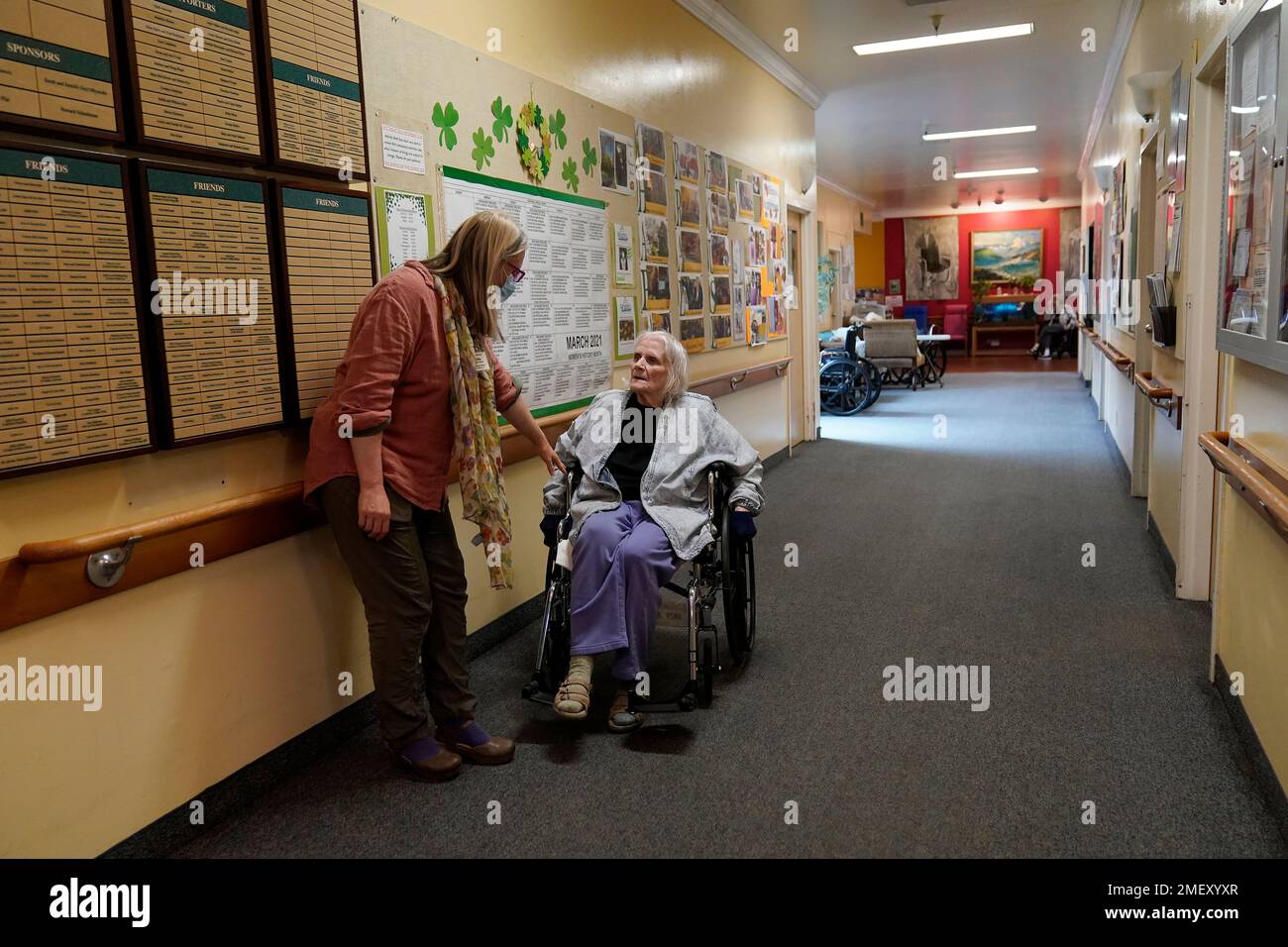 Chaparral House activities director Erika Shaver-Nelson, left, talks ...