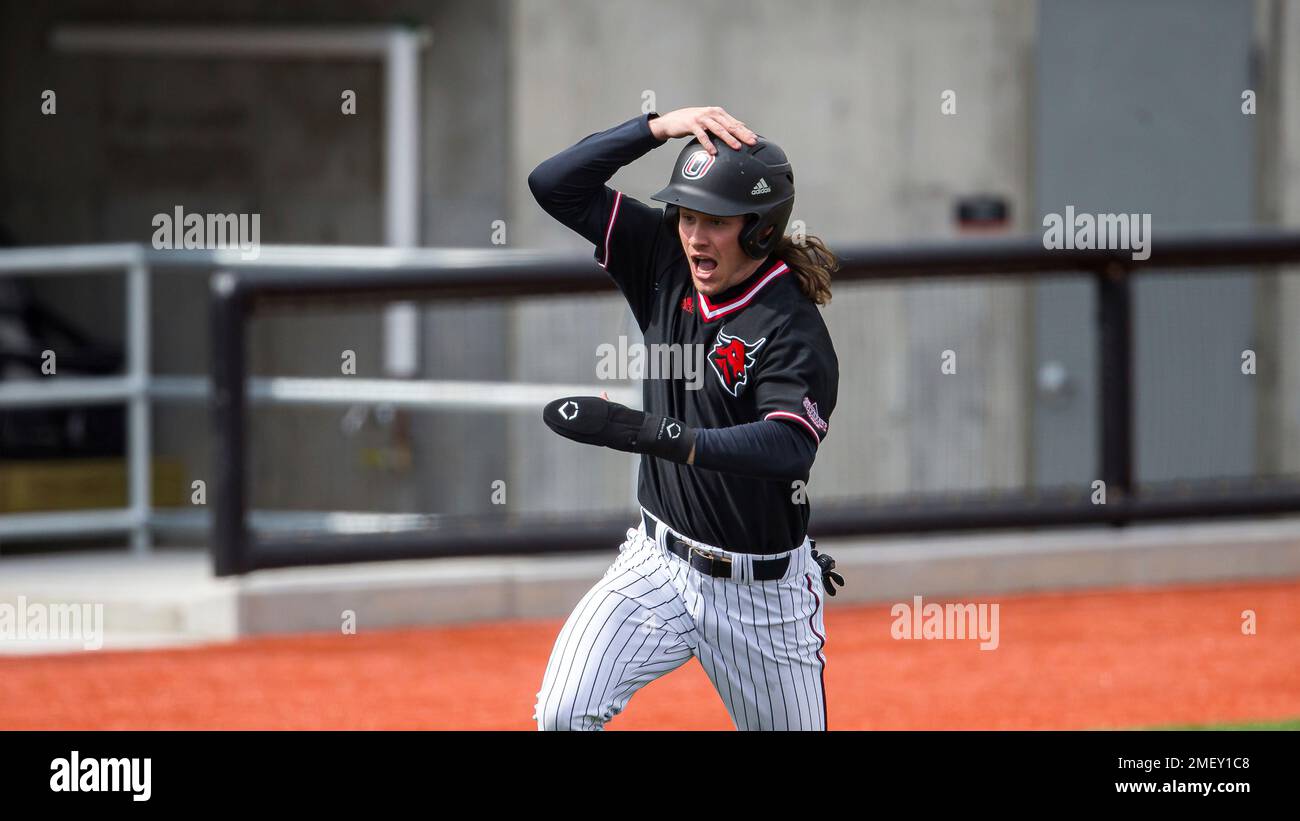 Omaha outfielder Garrett Kennedy (22) runs to home plate against South ...