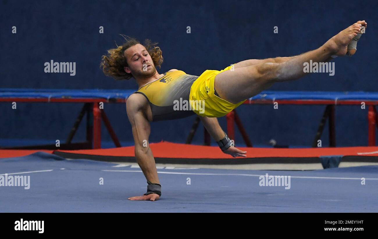 SC Unitred's William Pearce does his floor exercise during an NCAA ...