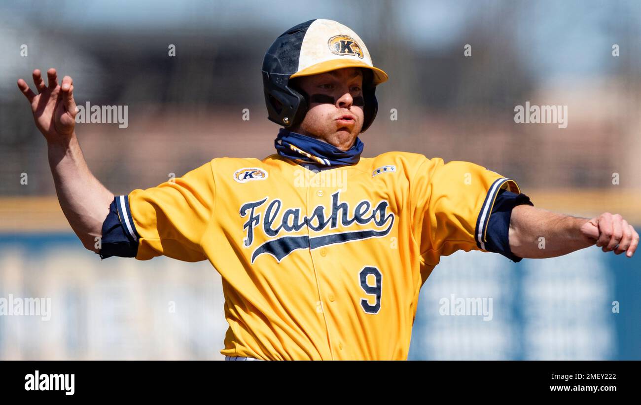 Kevin Dobos (9) of Kent State slides to home base during an NCAA ...