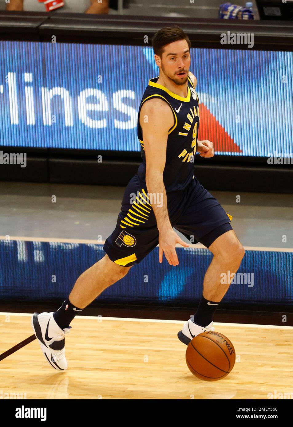 Indiana Pacers guard T.J. McConnell (9) brings the ball up court ...