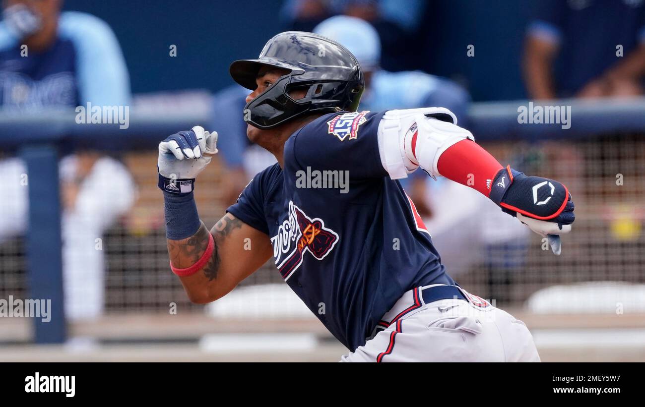 Atlanta Braves' Cristian Pache runs out a ground ball during a spring ...