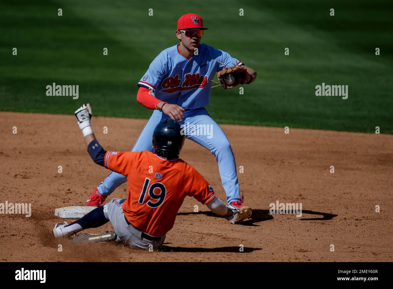 Mississippi shortstop Jacob Gonzalez (7) turns a double play as Auburn ...