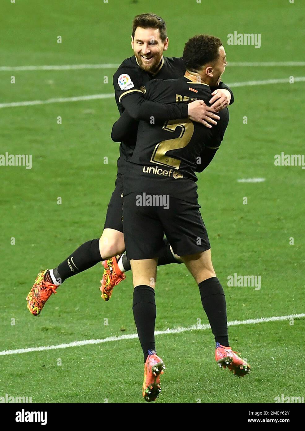 Barcelona's Sergino Dest celebrates with Barcelona's Lionel Messi ...