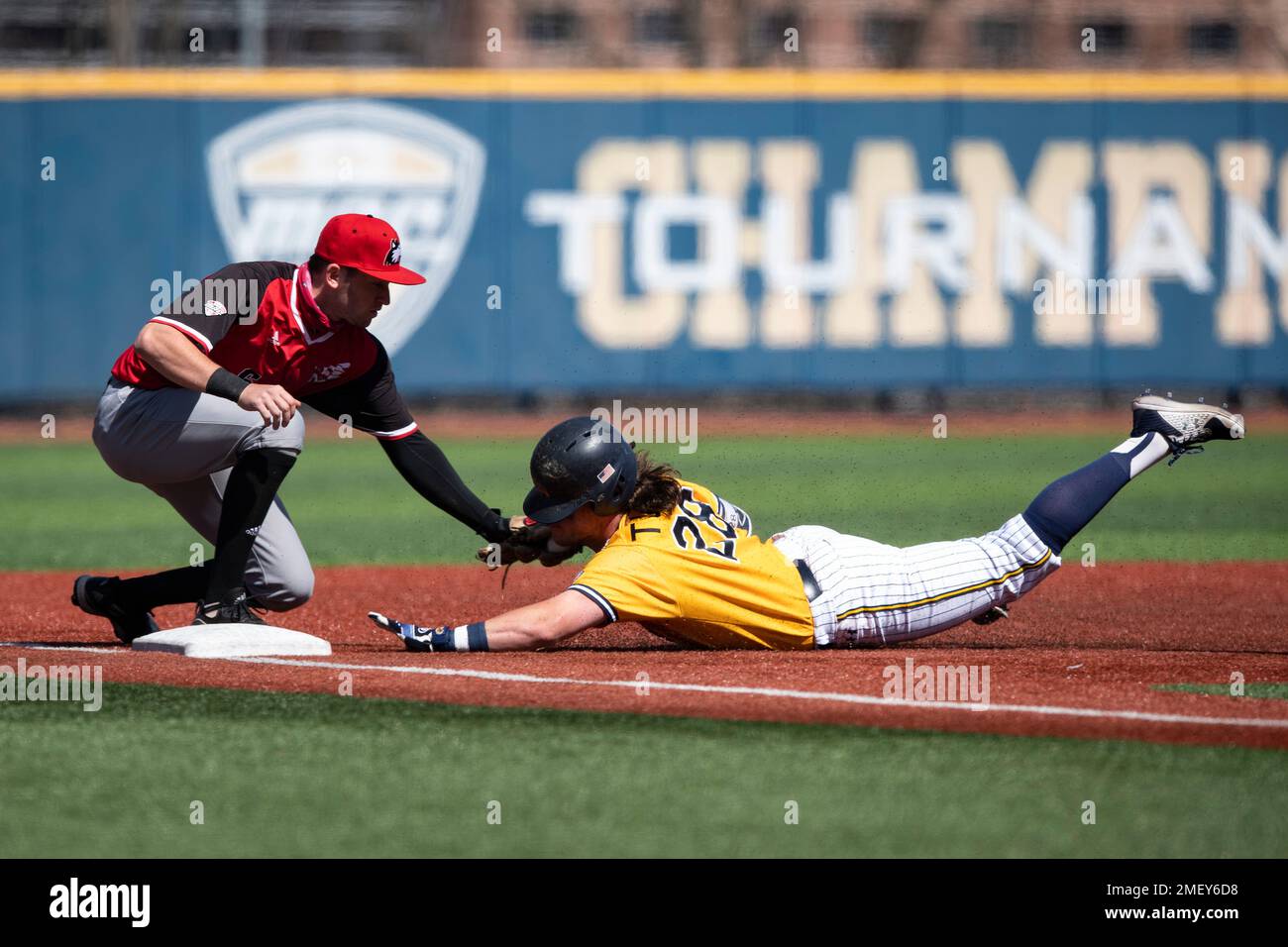 Micheal Turner (28) of Kent State slides safely into third base against ...
