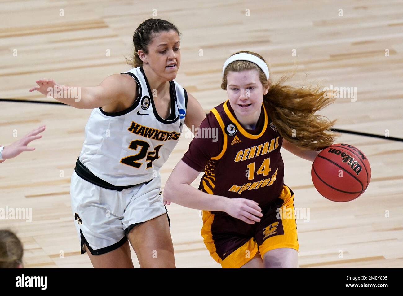 Central Michigan guard Molly Davis (14) drives past Iowa guard Gabbie ...