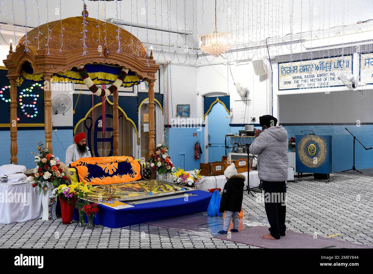 People pray at the Guru Nanak Gurdwara Sikh temple, on the day the ...