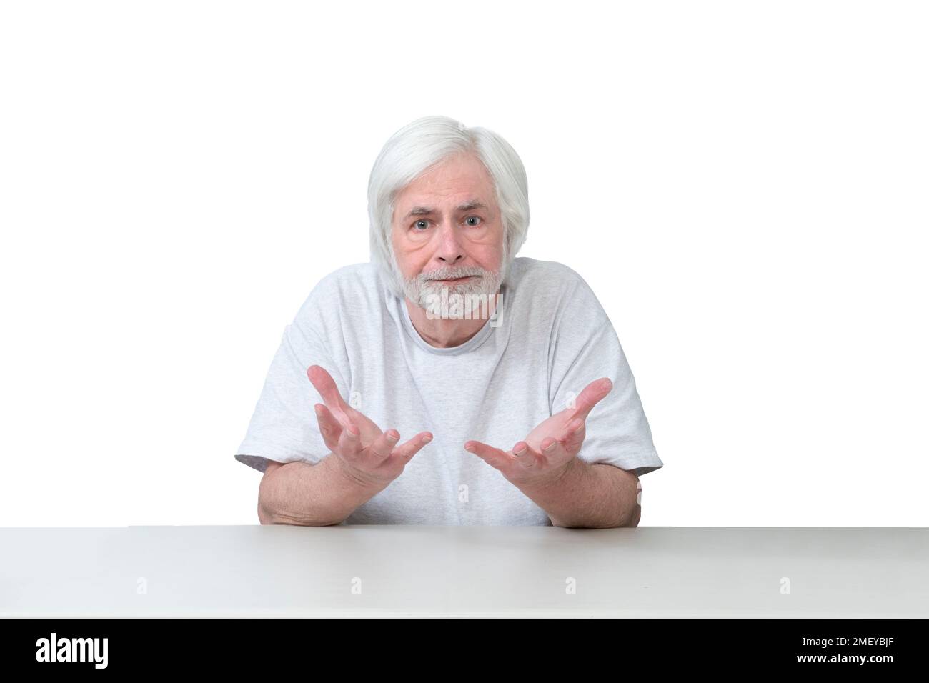 Horizontal shot of an unhappy white haired old man gesturing. Reaching ...