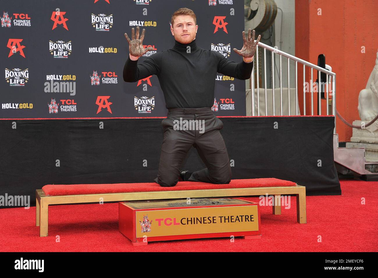 Boxer Canelo Alvarez poses for photos after placing his hands in cement ...