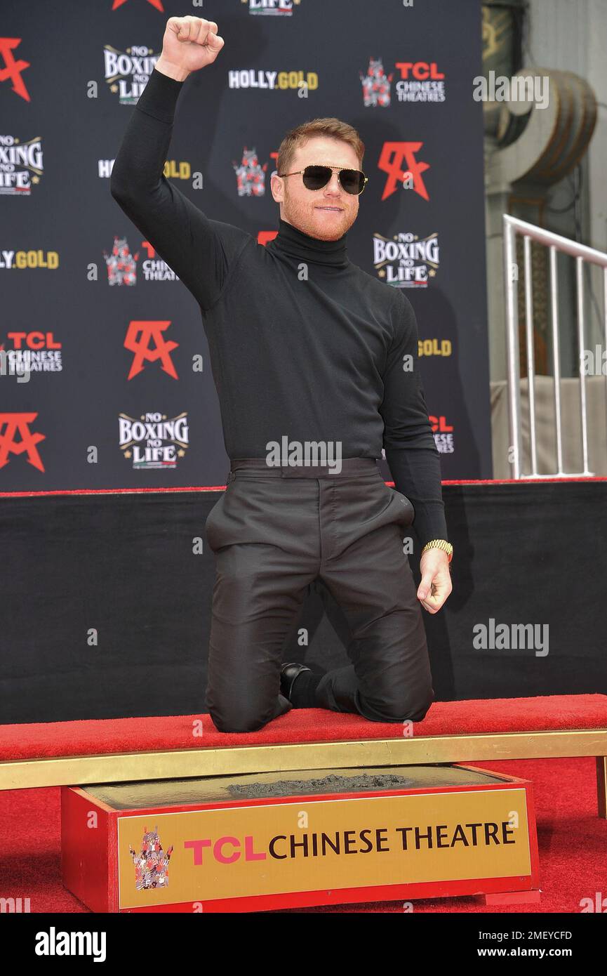 Boxer Canelo Alvarez poses for photos after signing his name in cement ...