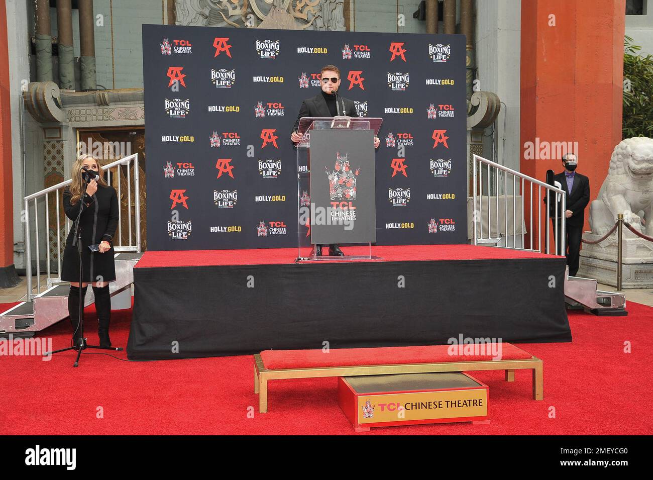 Boxer Canelo Alvarez speaks before placing his hands and feet in cement ...